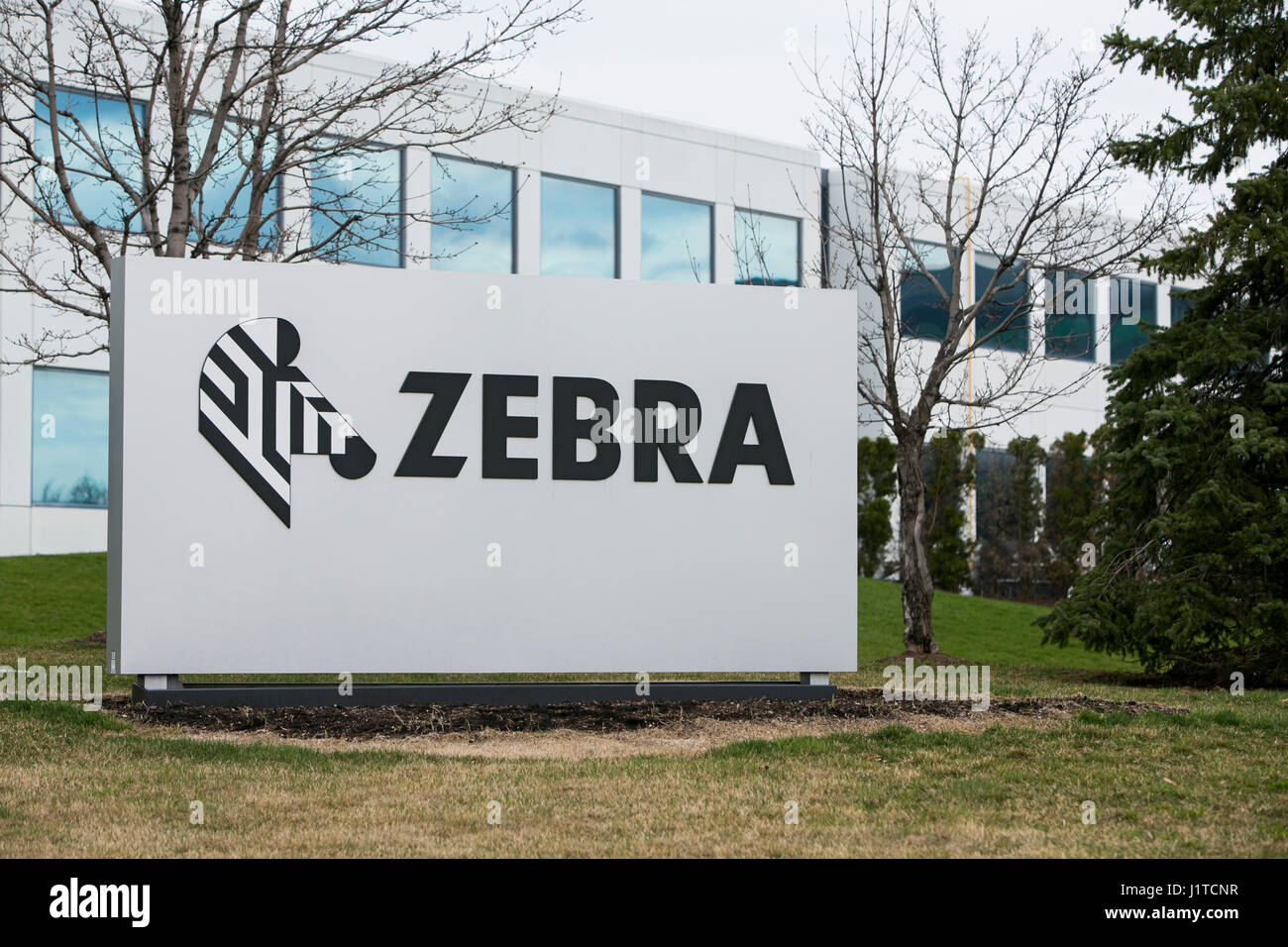 A logo sign outside of a facility occupied by Zebra Technologies in ...
