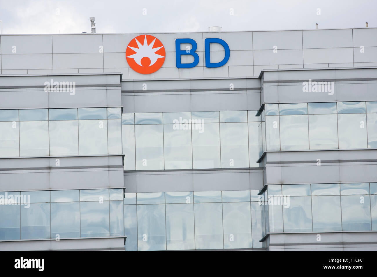 A logo sign outside of a facility occupied by Becton, Dickinson and ...
