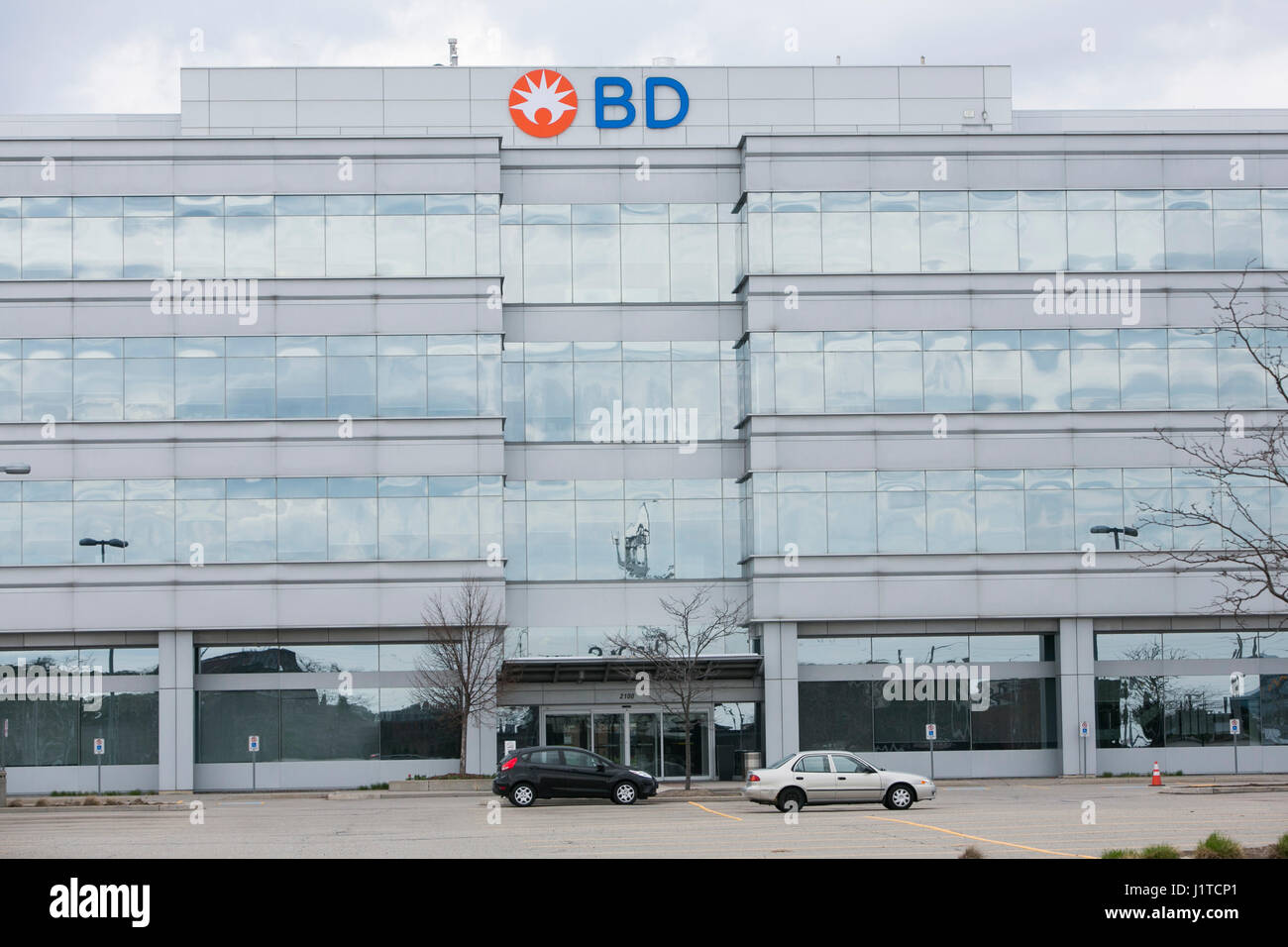 A logo sign outside of a facility occupied by Becton, Dickinson and ...