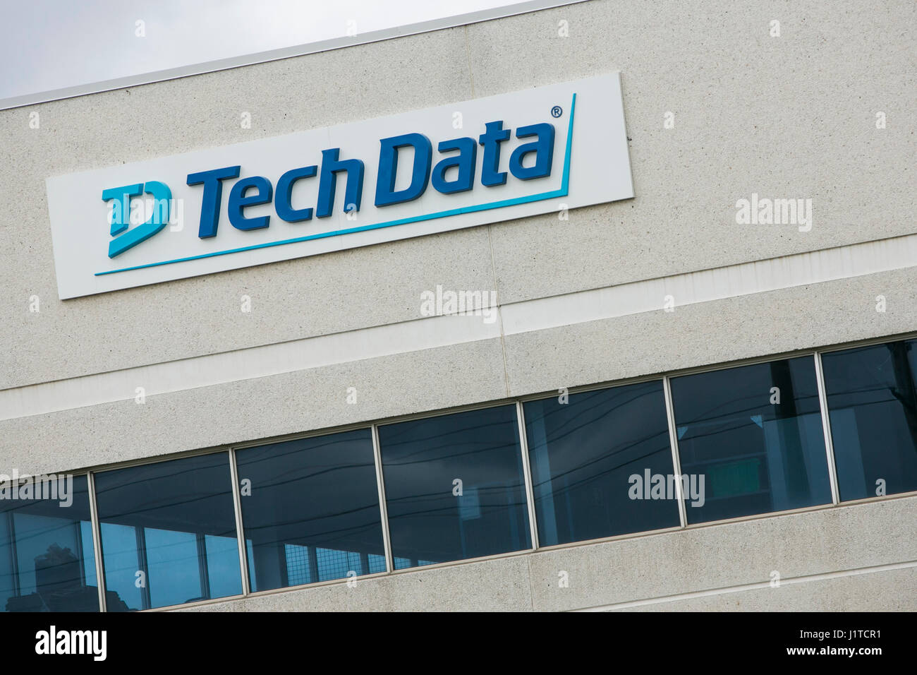A logo sign outside of a facility occupied by the Tech Data Corporation ...