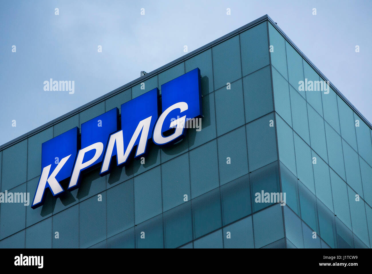A logo sign outside of a facility occupied by KPMG in Vaughan, Ontario ...