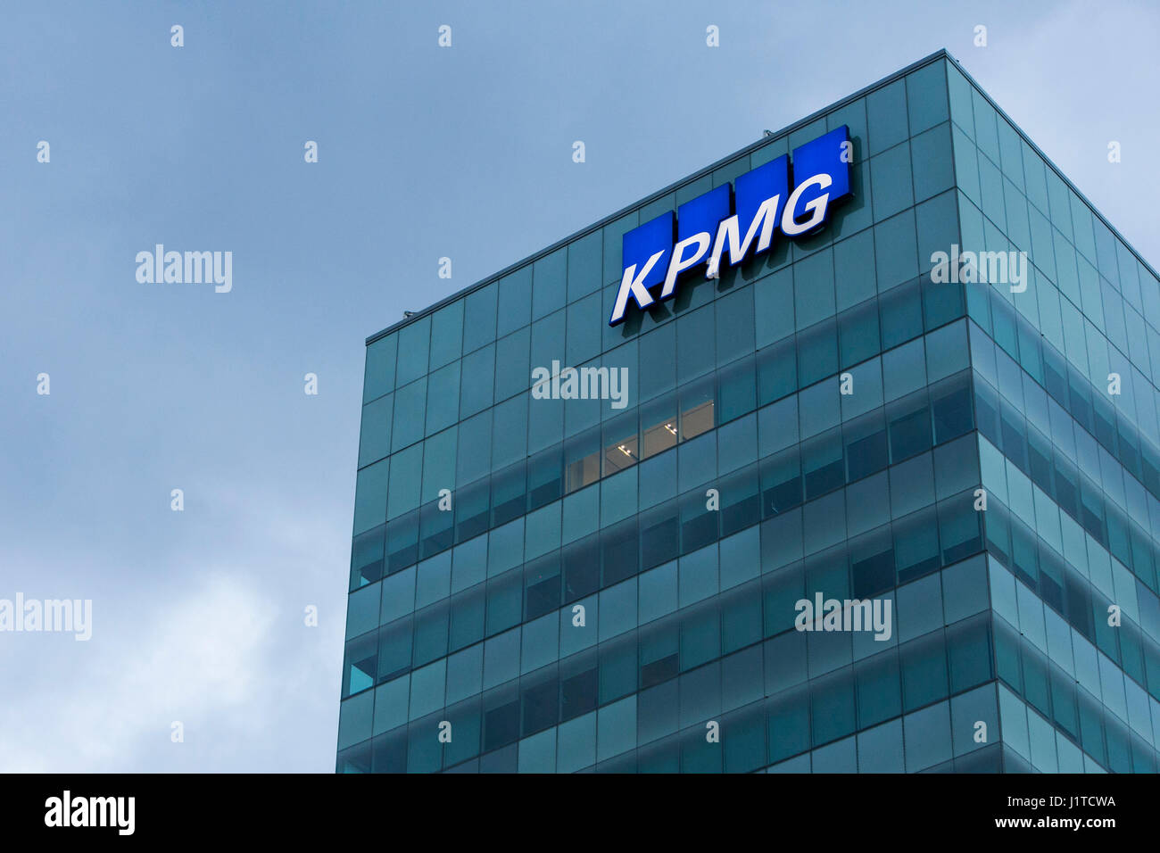 A logo sign outside of a facility occupied by KPMG in Vaughan, Ontario ...