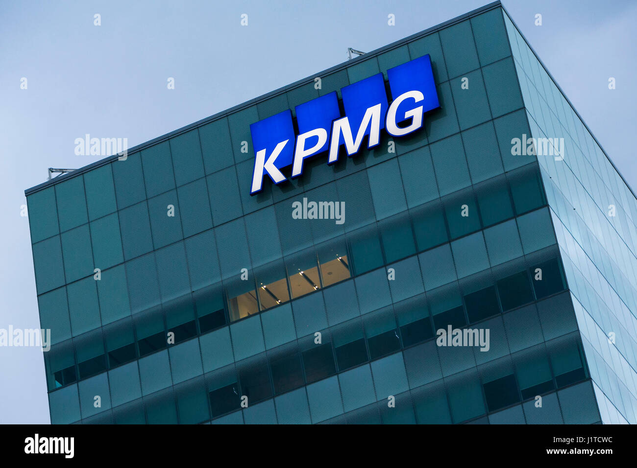 A logo sign outside of a facility occupied by KPMG in Vaughan, Ontario ...