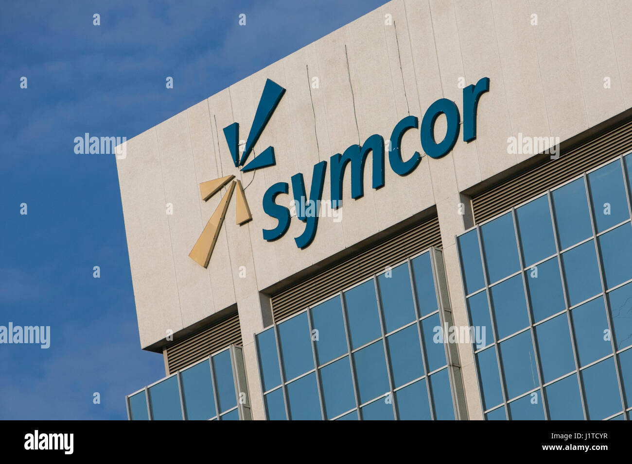 A logo sign outside of the headquarters of Symcor in Mississauga ...
