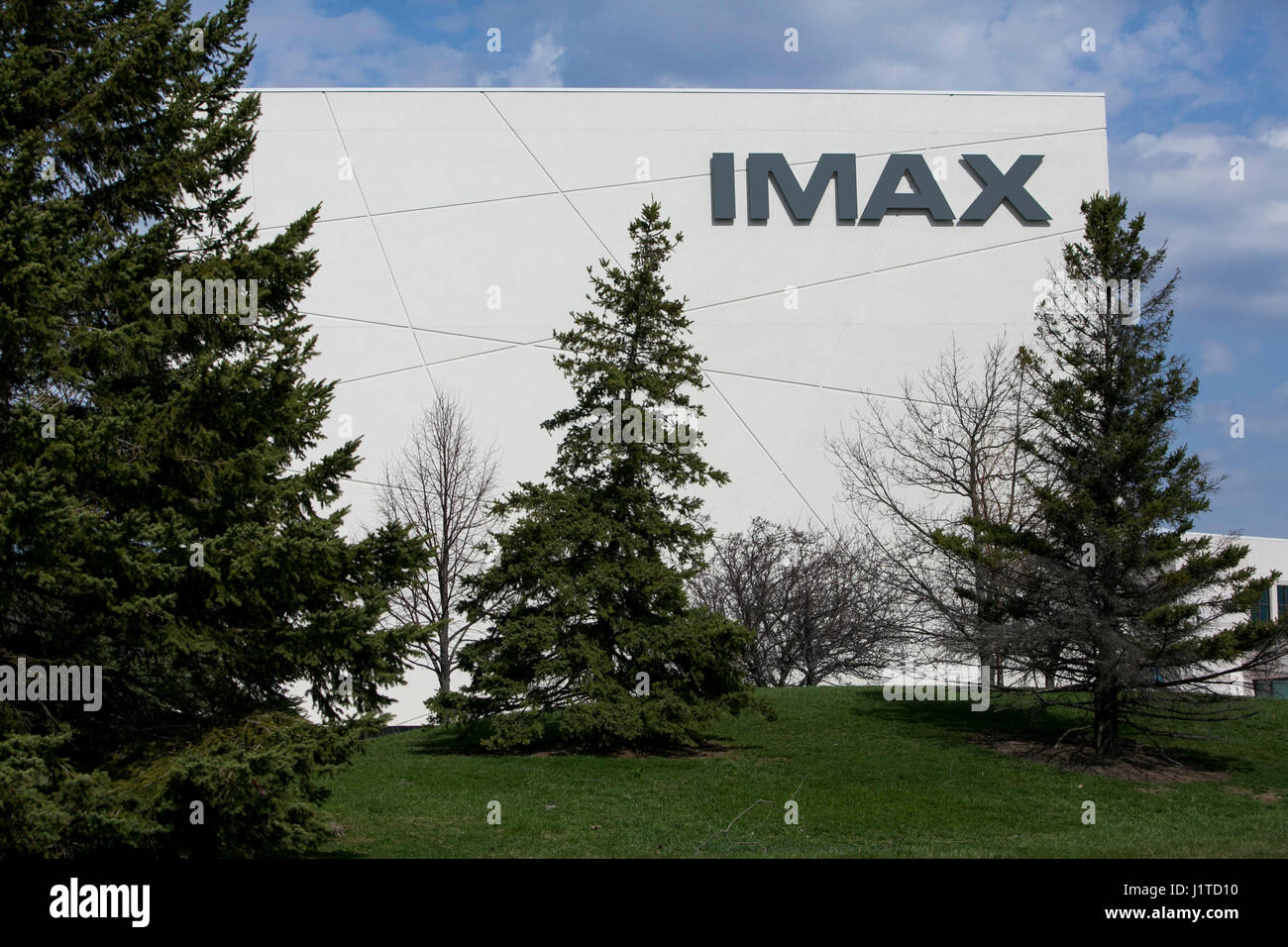 A logo sign outside of the headquarters of the IMAX Corporation in ...