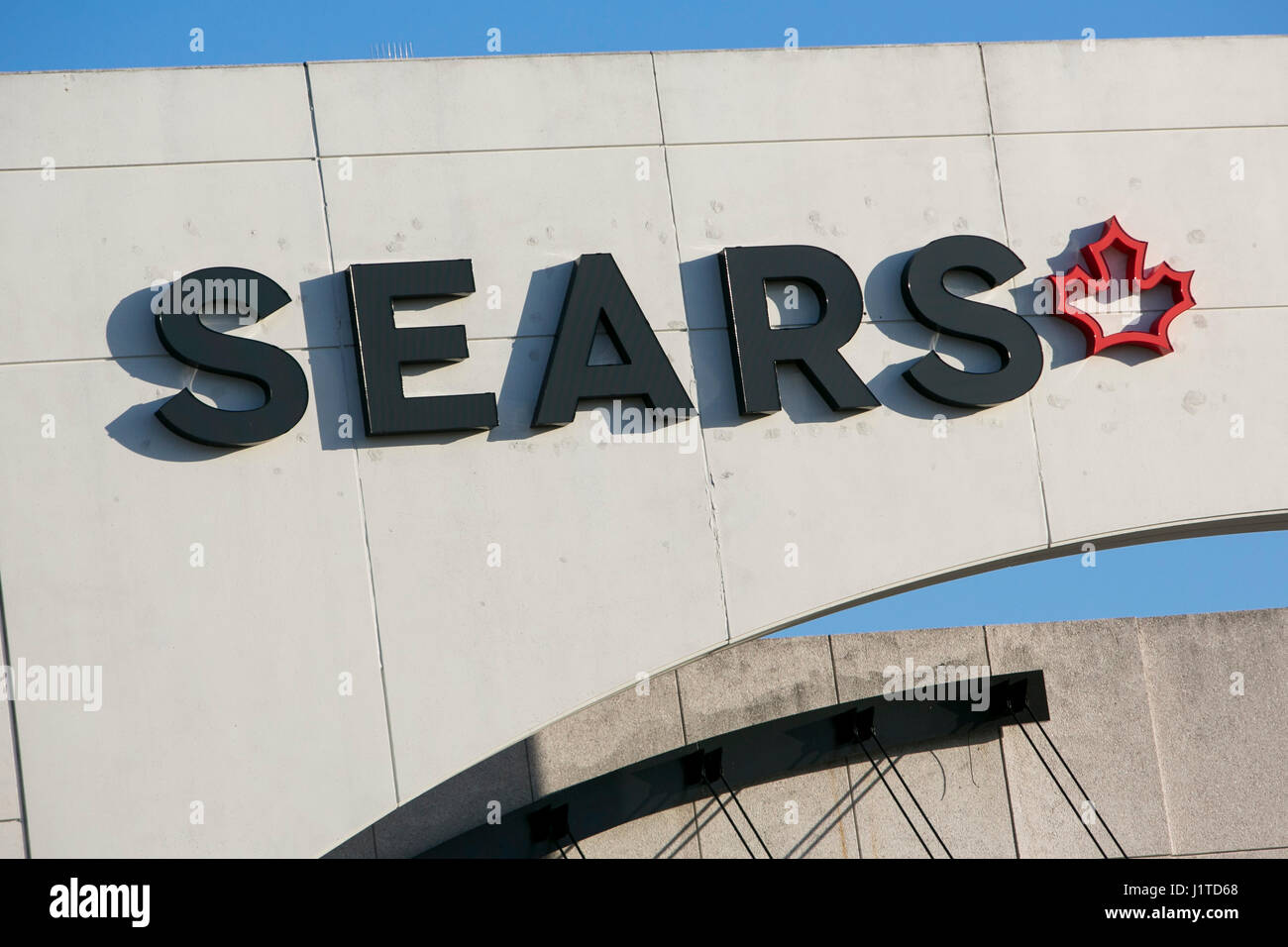 A logo sign outside of a Sears retail store in Burlington, ON, Canada ...