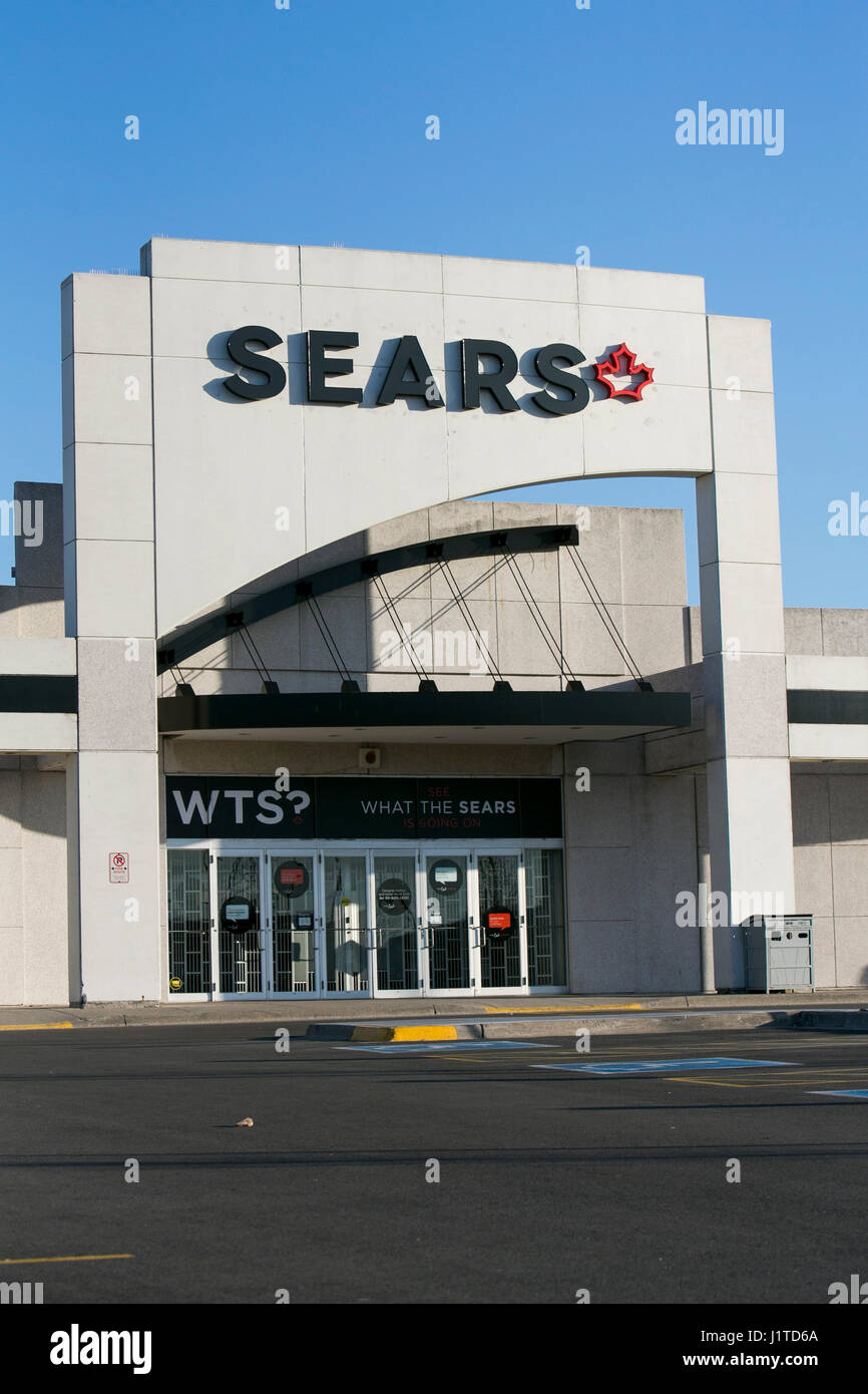A logo sign outside of a Sears retail store in Burlington, ON, Canada ...