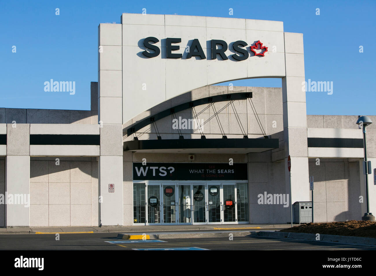 A logo sign outside of a Sears retail store in Burlington, ON, Canada ...