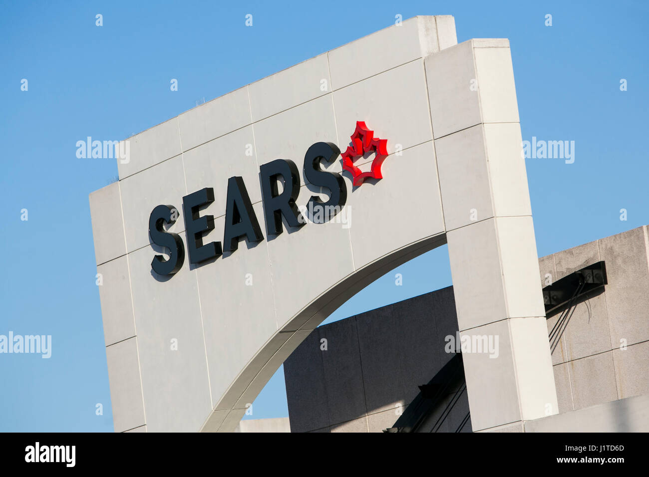 A logo sign outside of a Sears retail store in Burlington, ON, Canada ...