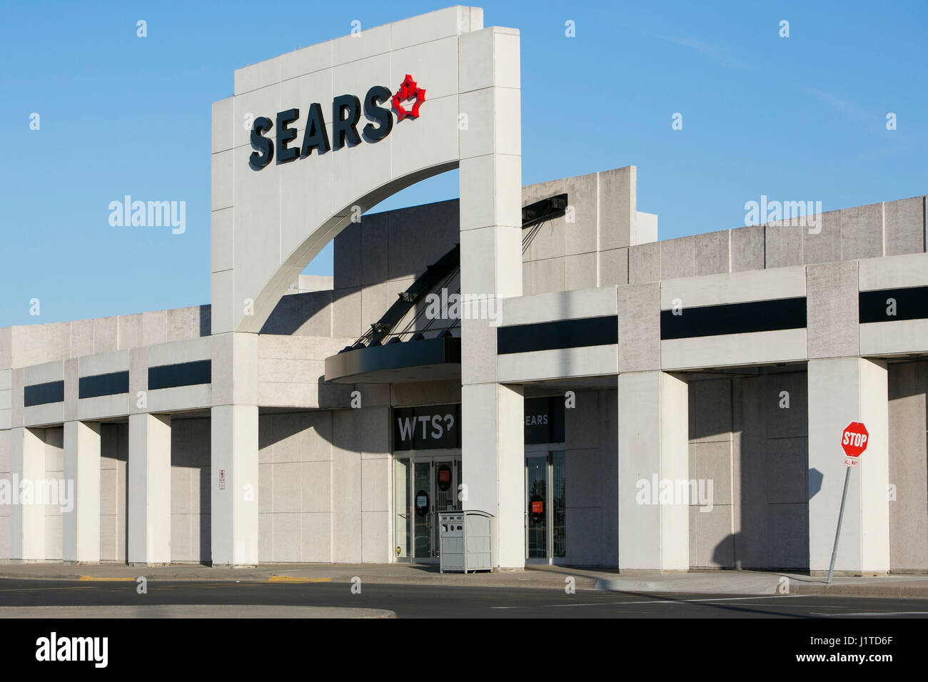 A logo sign outside of a Sears retail store in Burlington, ON, Canada ...