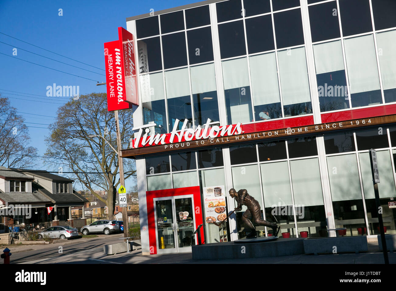 A logo sign outside of the location of the first Tim Hortons restaurant ...