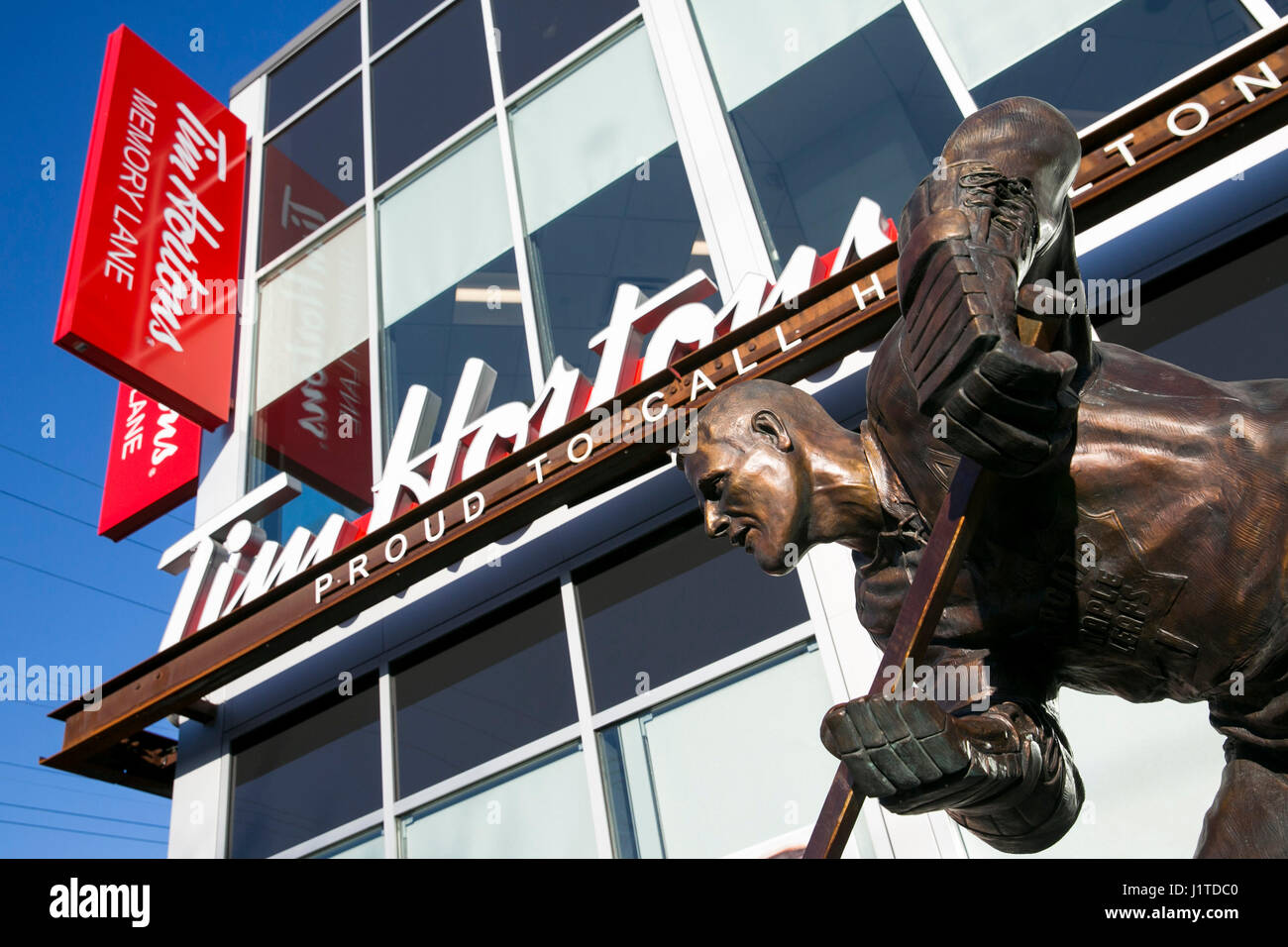 A logo sign outside of the location of the first Tim Hortons restaurant ...