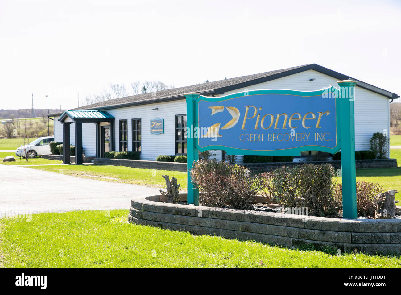 A logo sign outside of a facility occupied by Pioneer Credit Recovery ...