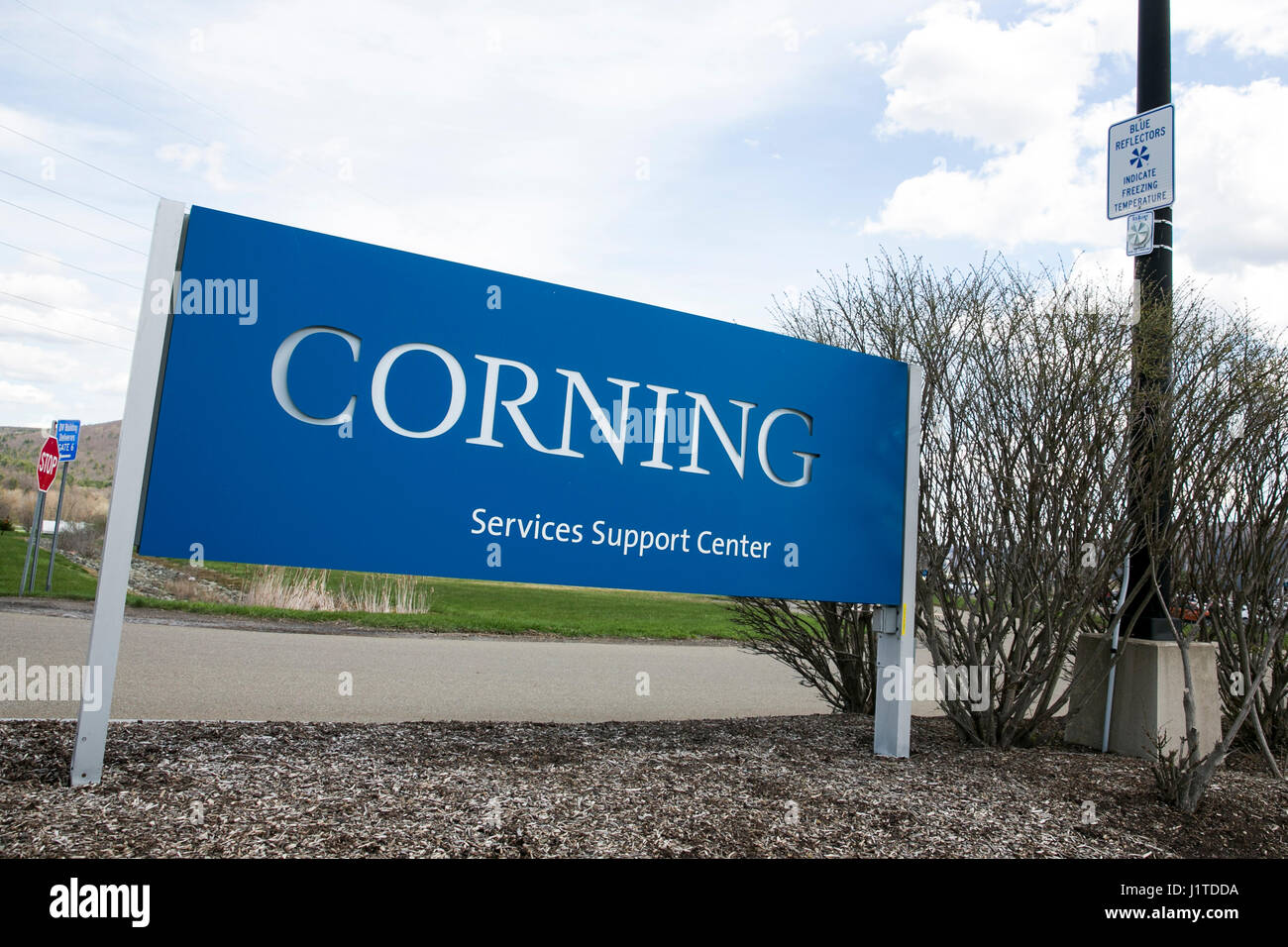 A logo sign outside of a facility occupied by Corning, Inc., in Corning ...