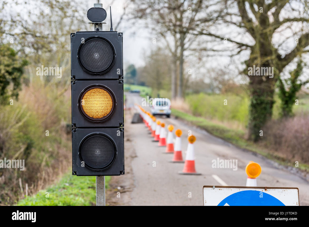 UK Motorway Roadworks Yellow Traffic Lights Cones Stock Photo - Alamy