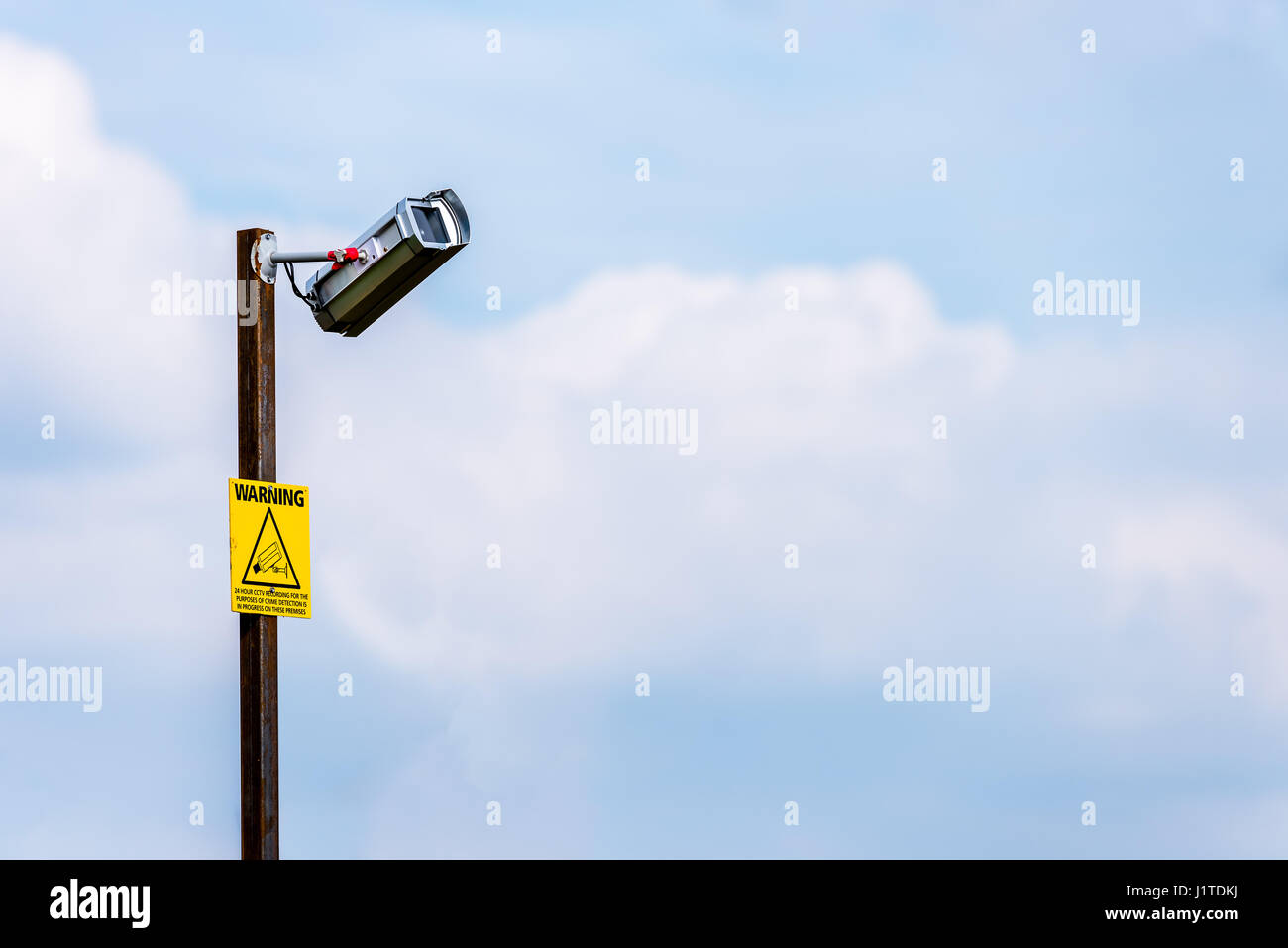 Day View of Broken CCTV camera with yellow notice Stock Photo - Alamy