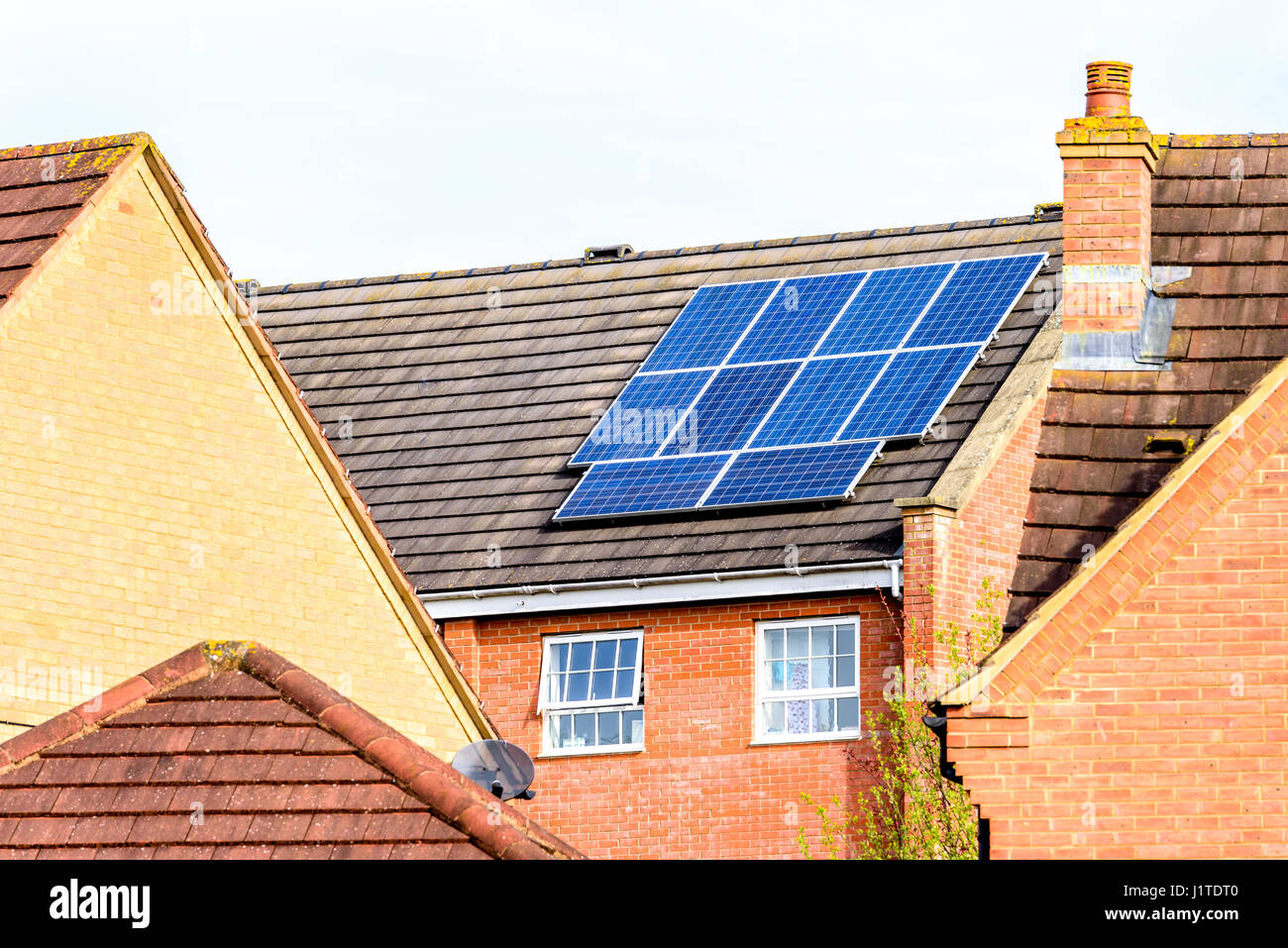 UK Solar Energy Panel on Sunny Roof Stock Photo - Alamy