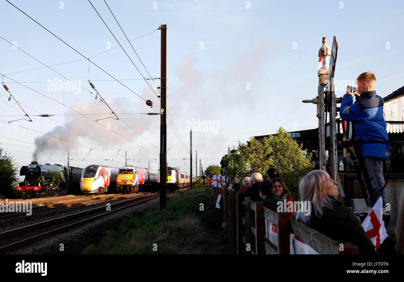 EDITORIAL USE ONLY (left to right) The Flying Scotsman and Virgin Trains' new Azuma travel in ...
