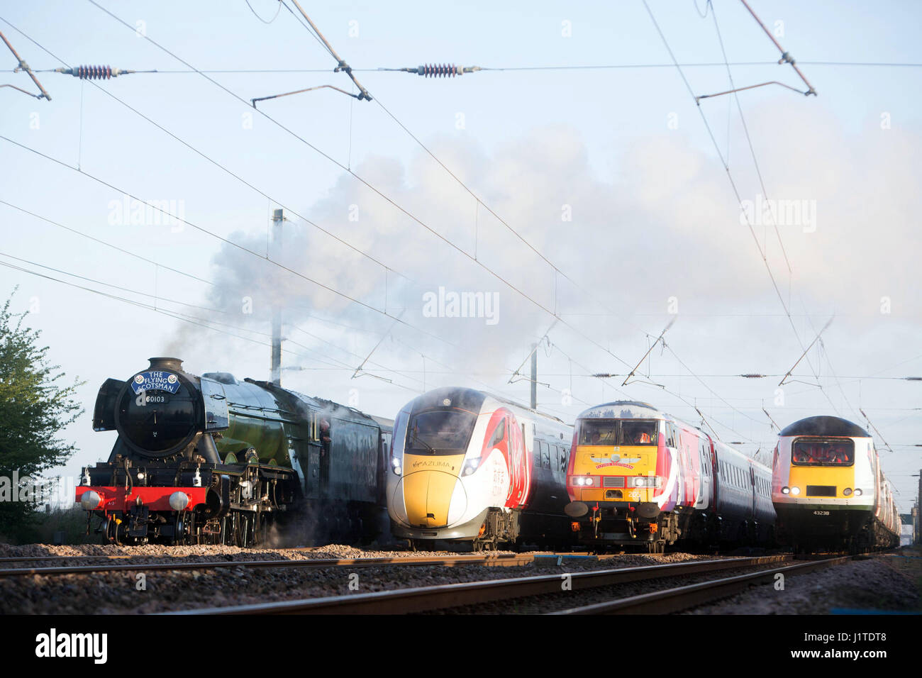 EDITORIAL USE ONLY (left to right) The Flying Scotsman and Virgin Trains' new Azuma travel in ...