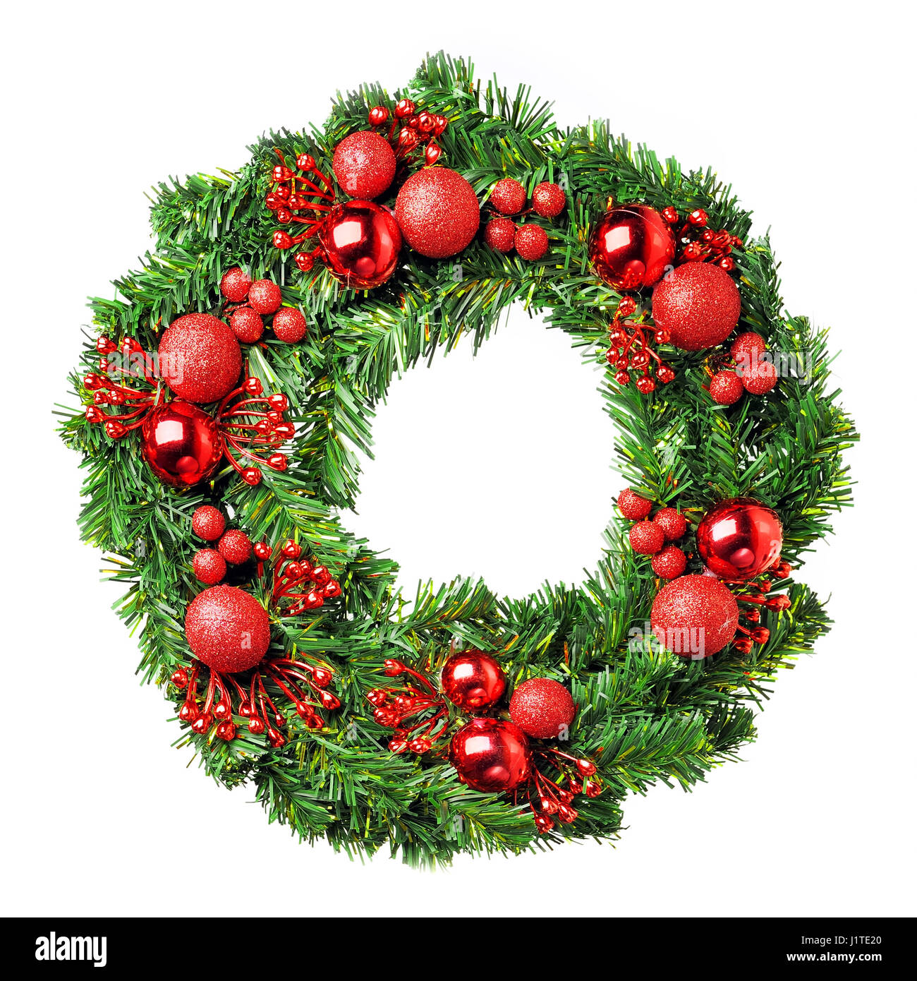 Loaded Christmas wreath isolated on white Stock Photo - Alamy