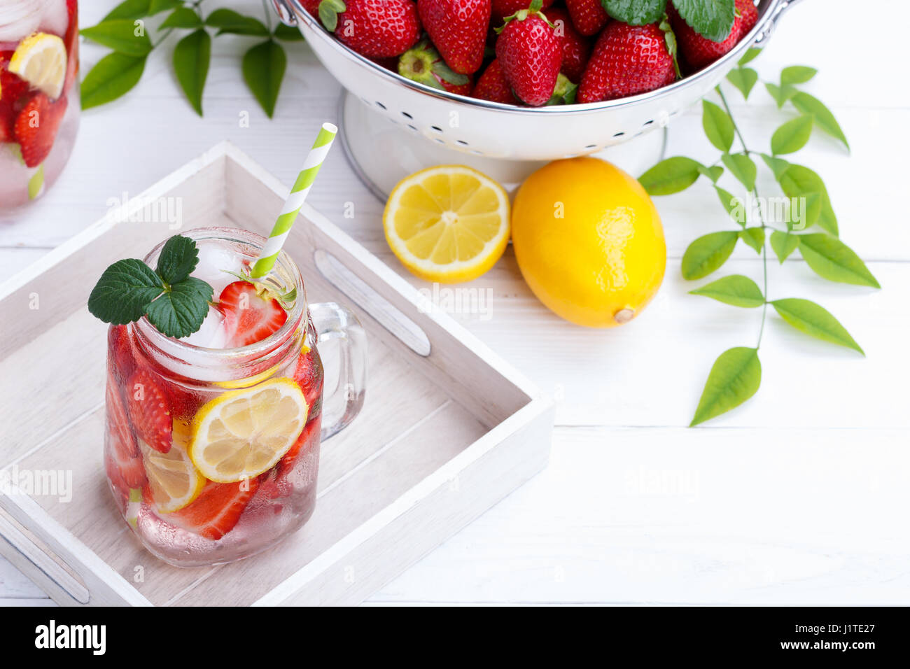 Detox fruit infused flavored water. Refreshing summer homemade cocktail ...