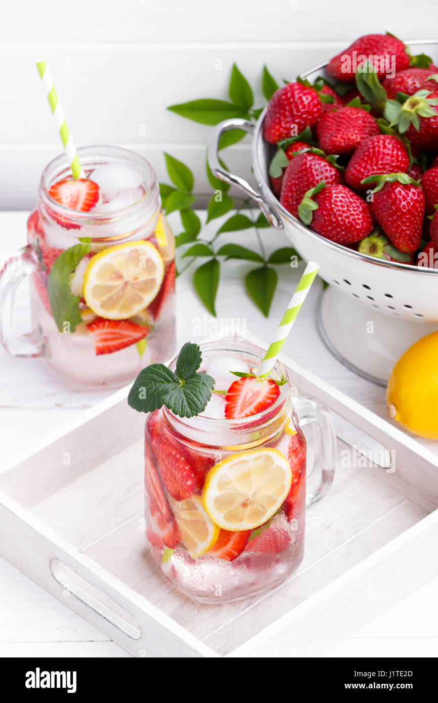 Detox fruit infused flavored water. Refreshing summer homemade cocktail ...