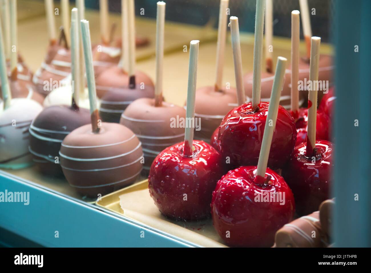 Candied apples on a stick at a fair Stock Photo - Alamy