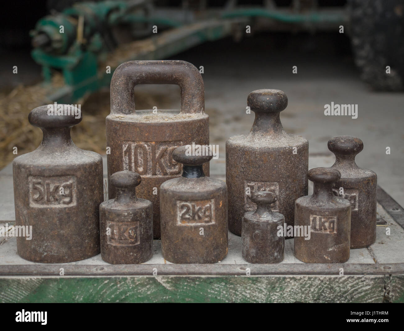 Old, metal weights of different size for a scale Stock Photo - Alamy