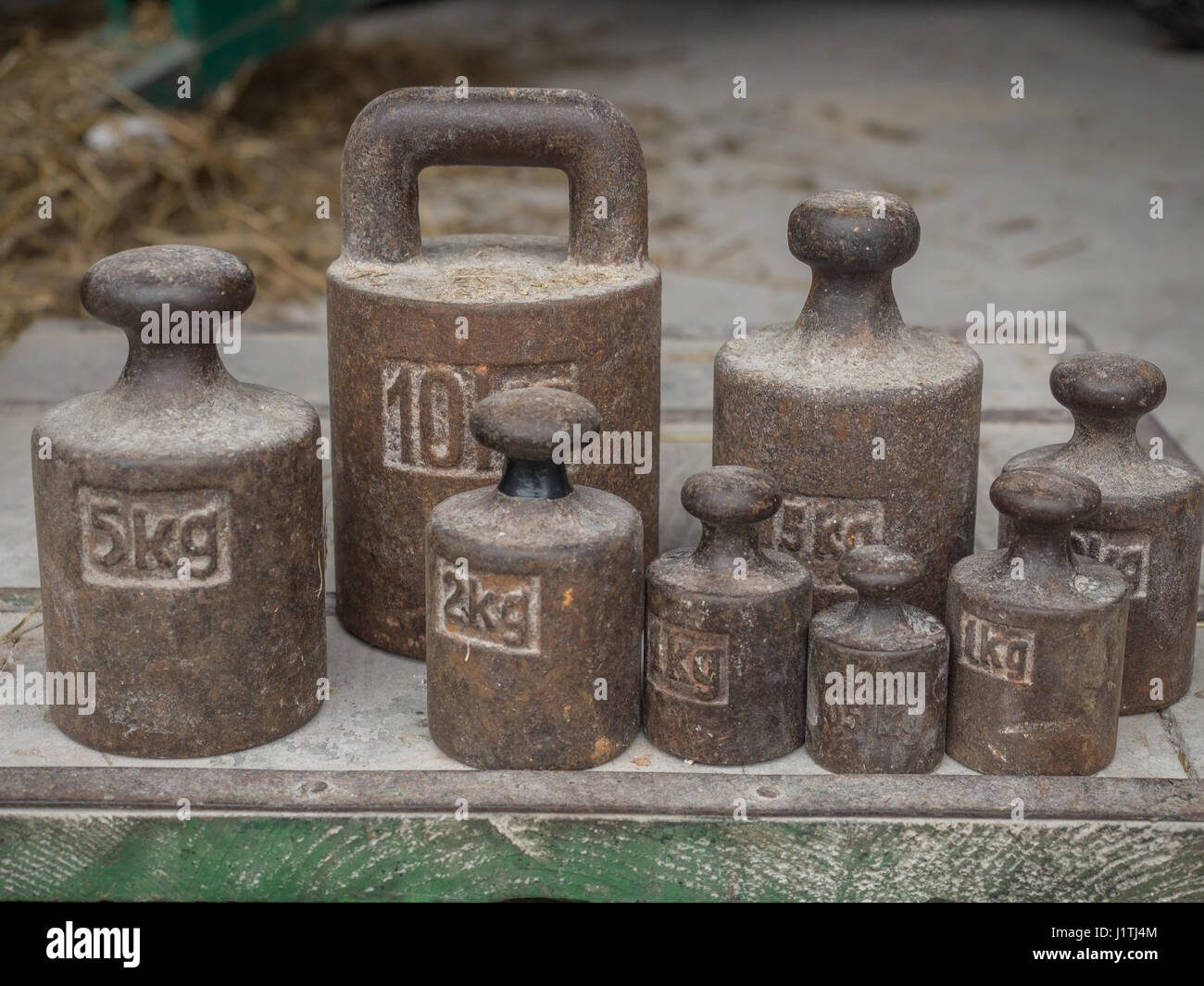 Old, metal weights of different size for a scale Stock Photo - Alamy