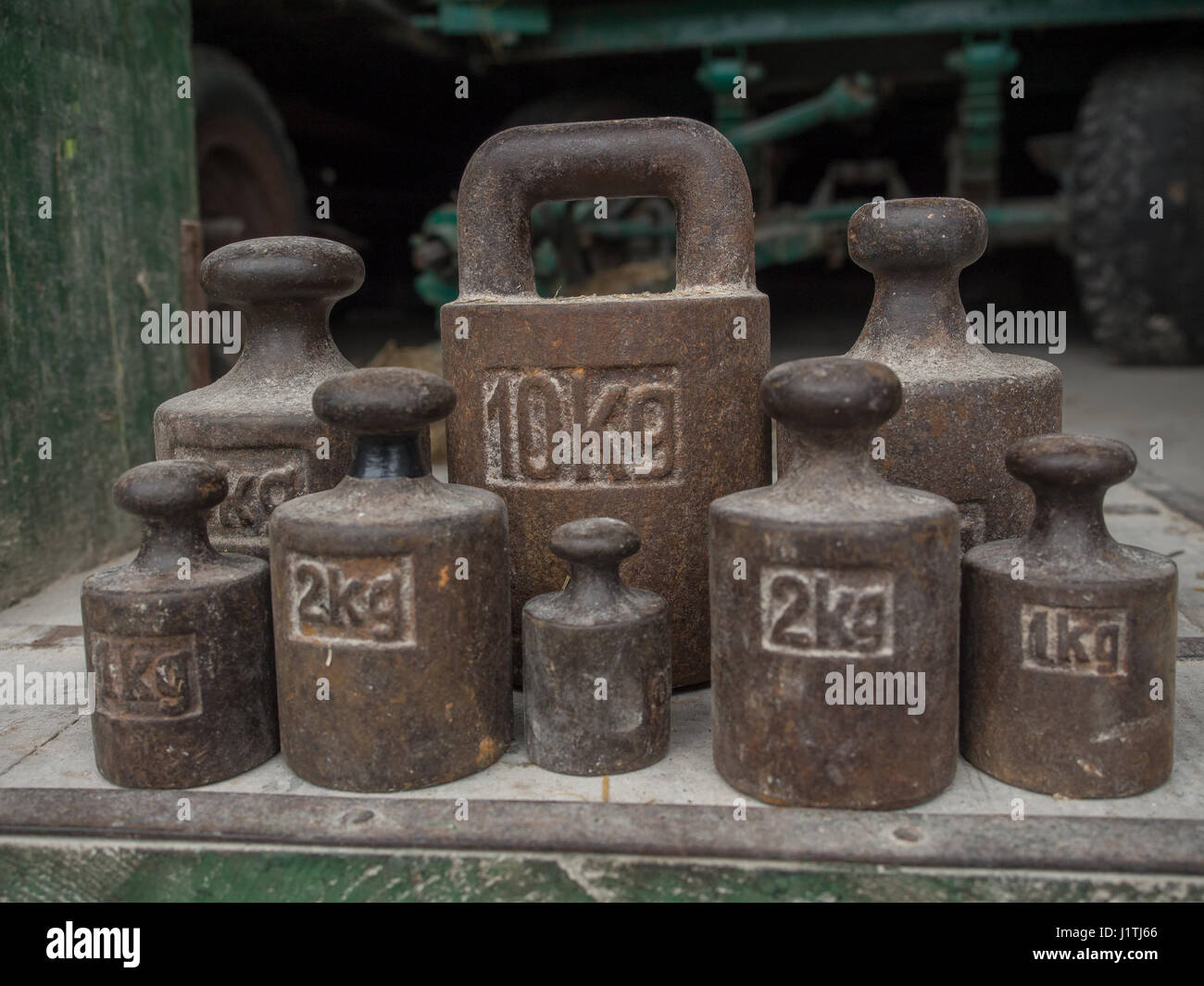 Old, metal weights of different size for a scale Stock Photo - Alamy
