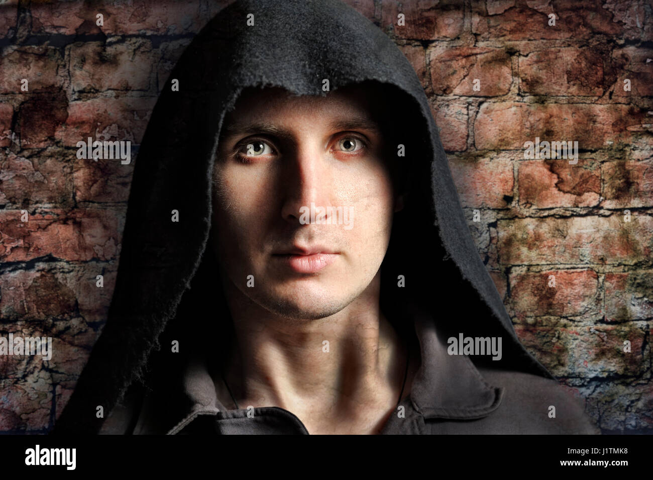 Man in black cloak with hood hi-res stock photography and images - Alamy