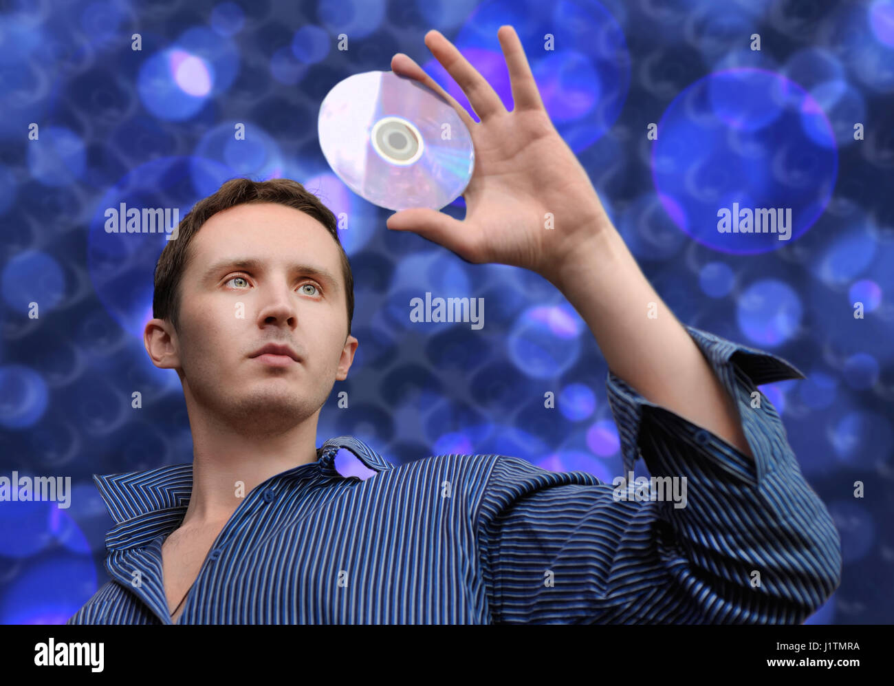 Man with compact disc in his hand Stock Photo - Alamy
