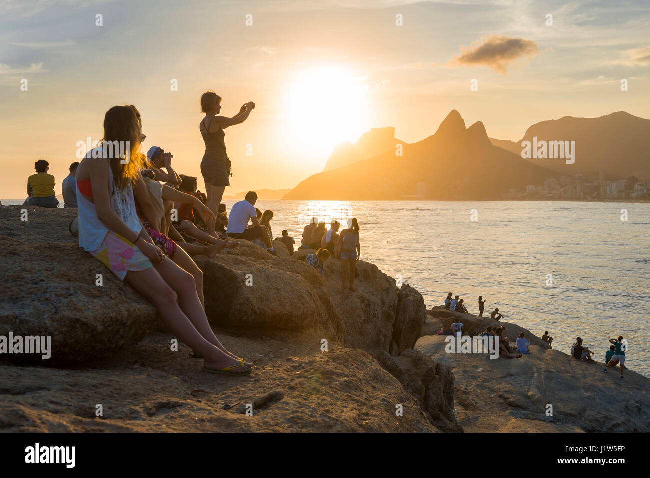 RIO DE JANEIRO - People on the rocks at Arpoador jostle for position to ...