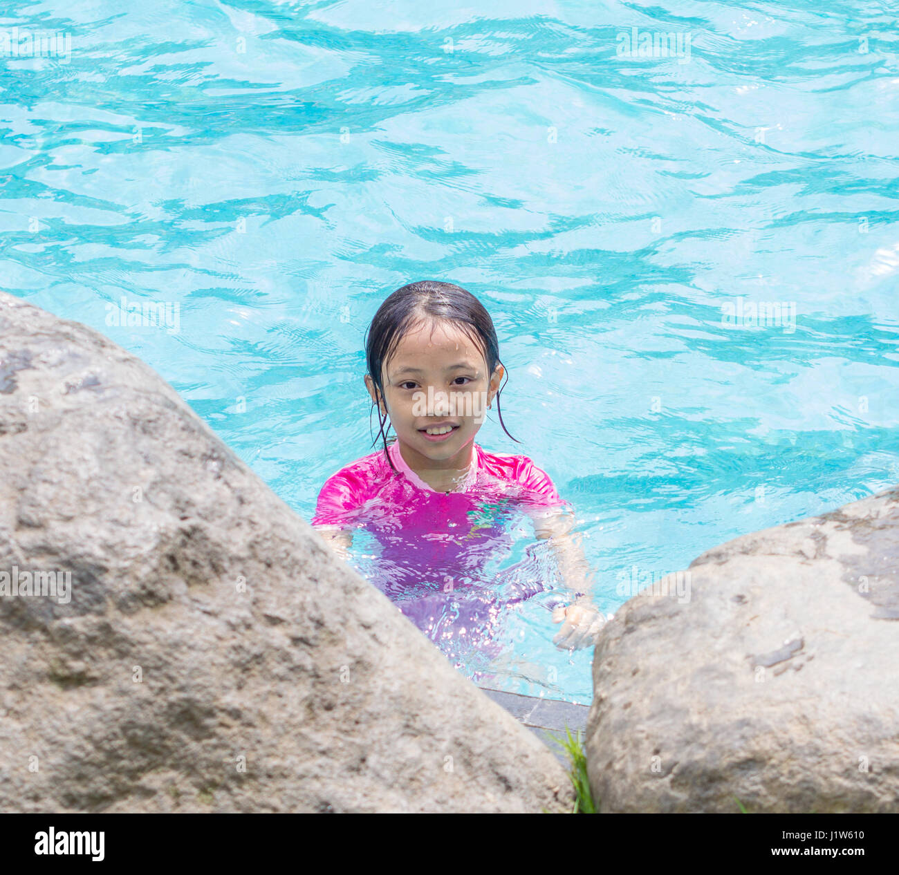 Smiling Asian Girl Pool Side High Resolution Stock Photography and ...