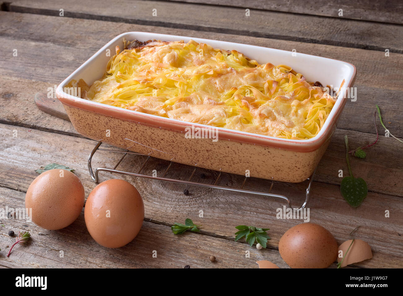 Baked pasta gratin with cheese and egg Stock Photo - Alamy