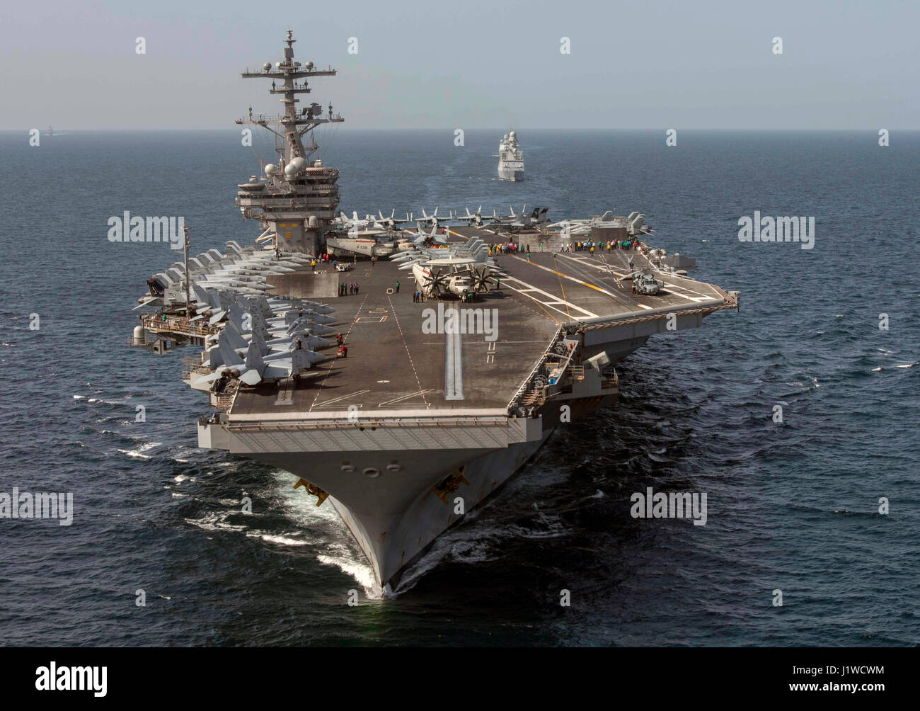 The USN Nimitz-class aircraft carrier USS George H.W. Bush steams ...