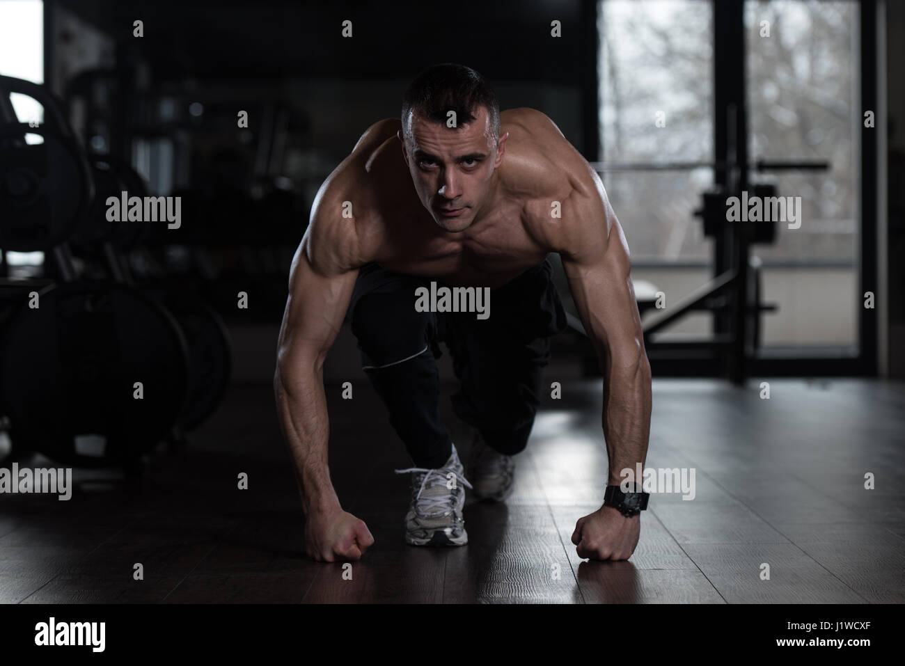 Strong muscular men kneeling on hi-res stock photography and images - Alamy