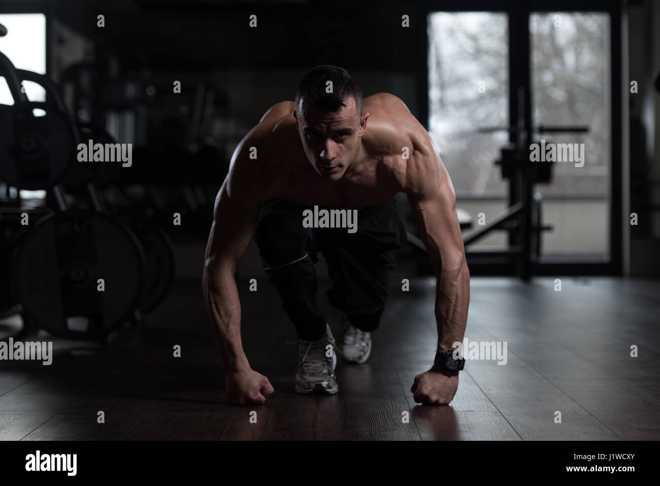 Strong muscular men kneeling on hi-res stock photography and images - Alamy
