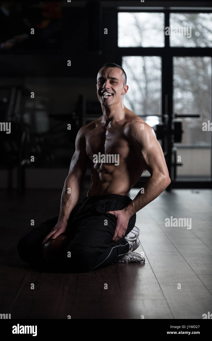 Resting Time - Confident Muscled Young Man Resting In Healthy Club Gym ...