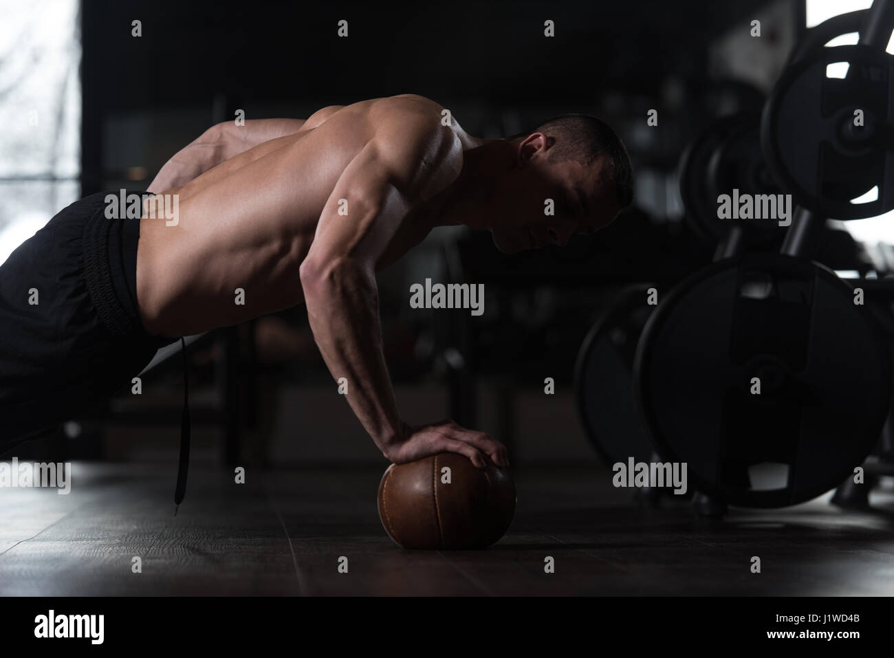Muscular athlete doing one hand hi-res stock photography and images - Alamy