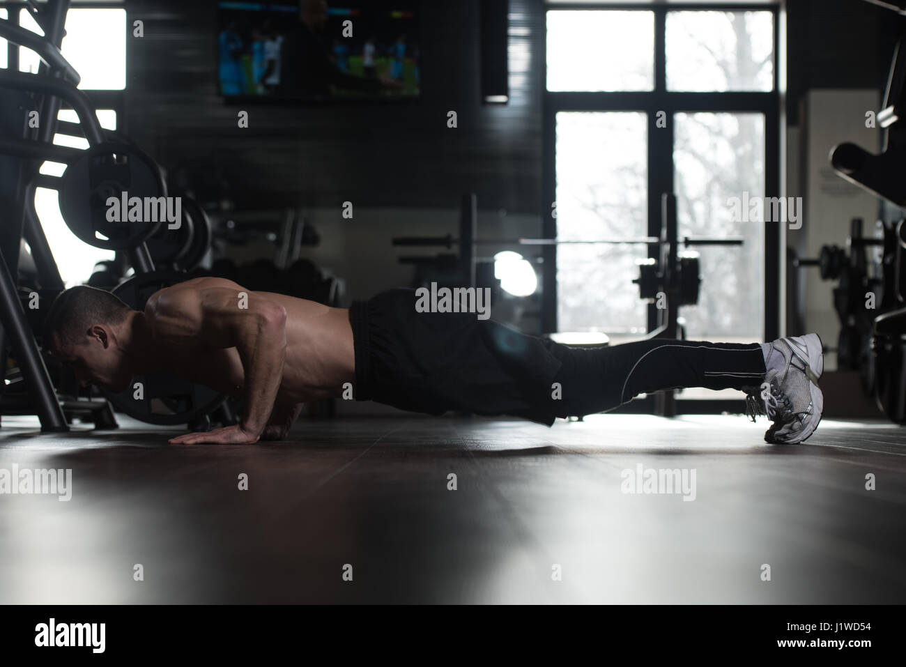 Young Man Athlete Doing Pushups As Part Of Bodybuilding Training Stock ...