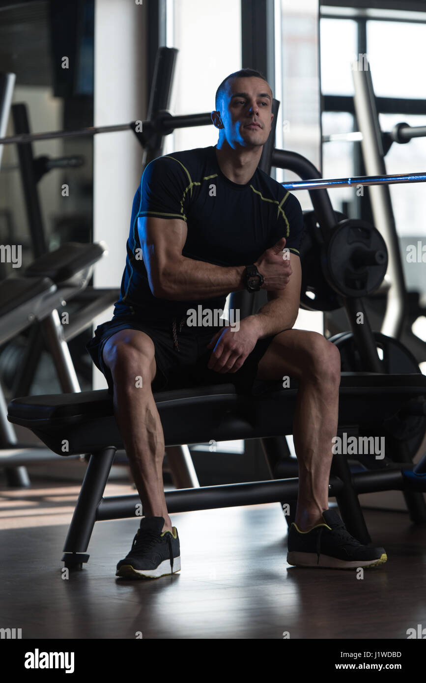 Resting Time - Confident Muscled Young Man Resting In Healthy Club Gym ...