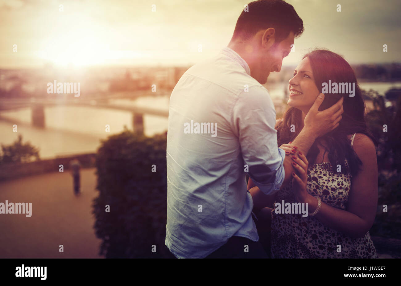 Romantic couple dating and being romantic during sunset Stock Photo - Alamy