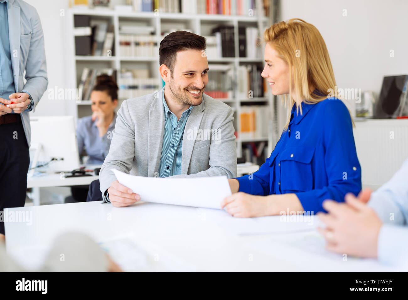 Succeful business partners brainstorming in office Stock Photo - Alamy