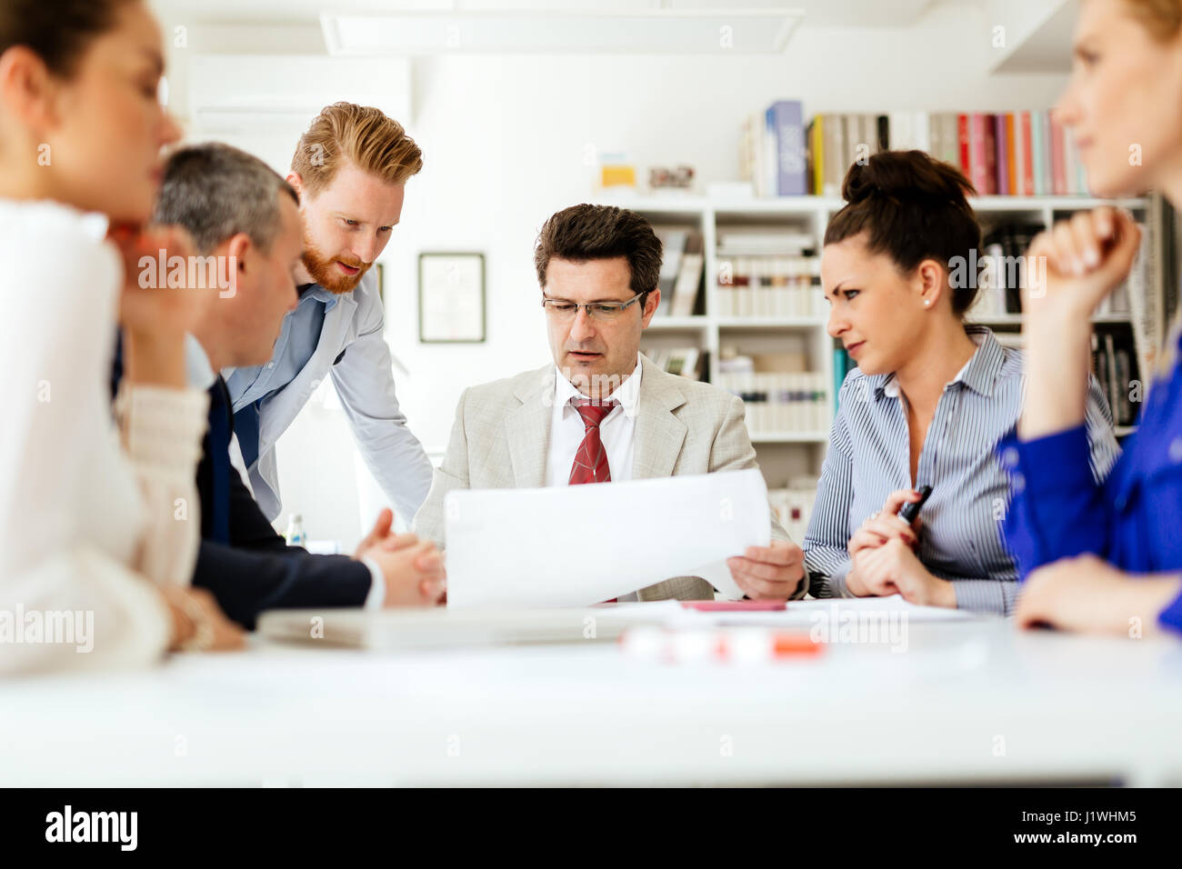 Business people discussing future plans in modern office Stock Photo ...