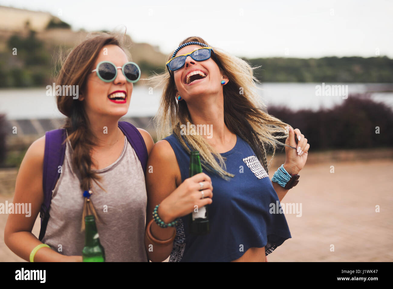 Beautiful happy friends laughing and smiling outdoors Stock Photo - Alamy