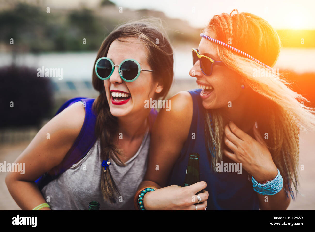 Beautiful happy friends laughing and smiling outdoors Stock Photo - Alamy