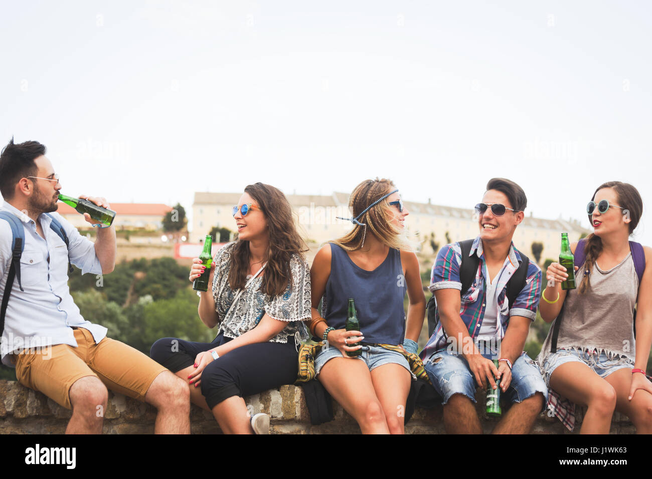 Group of friends having fun outdoors and are happy Stock Photo - Alamy