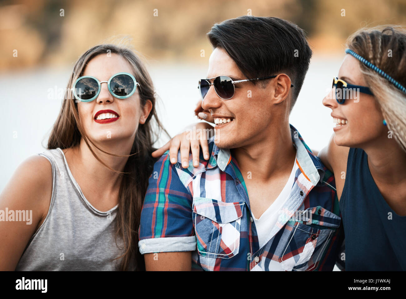 Beautiful happy friends laughing and smiling outdoors Stock Photo - Alamy