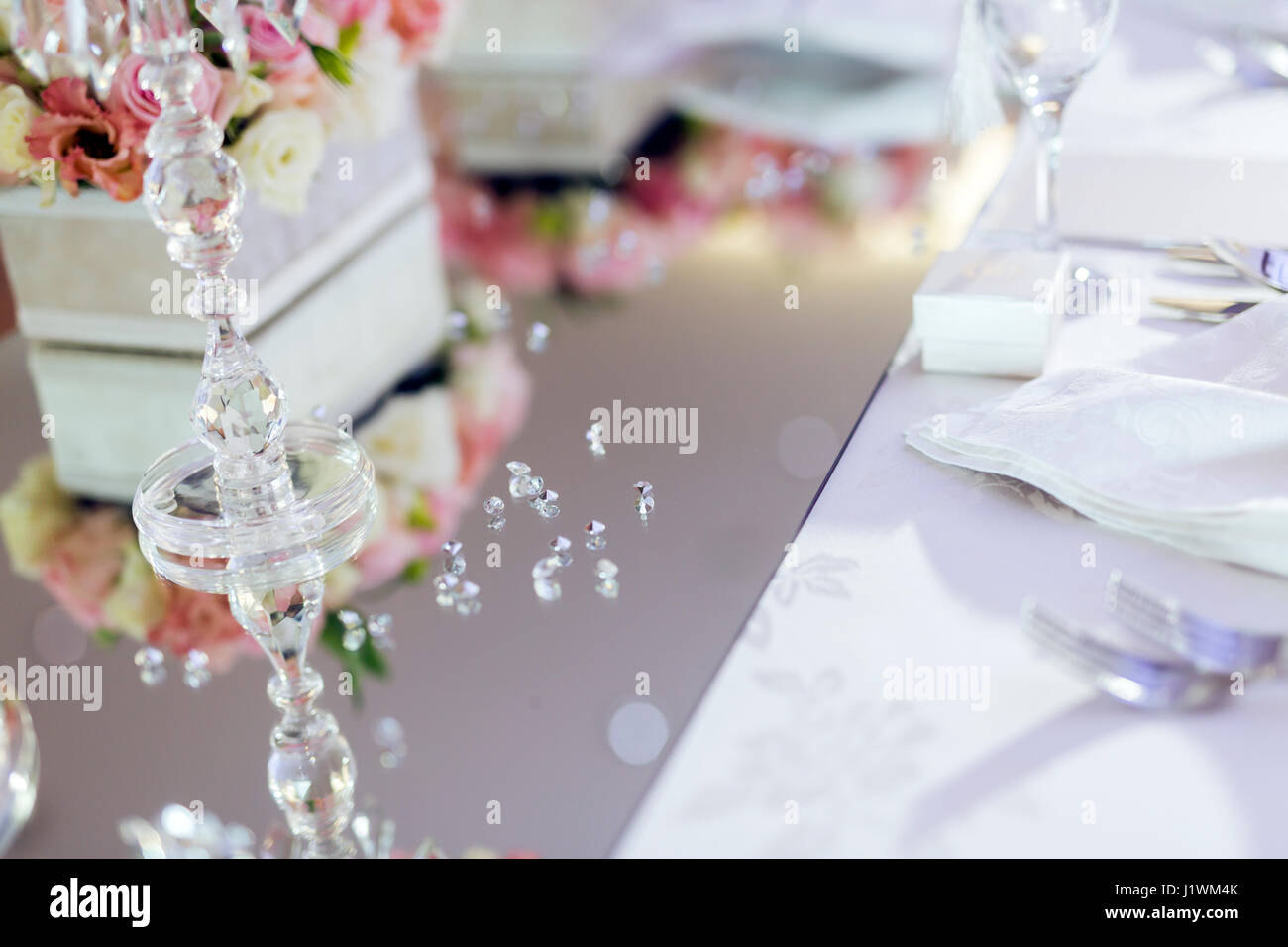 Beautiful wedding arrangement with crystals on table Stock Photo - Alamy